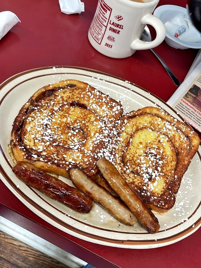 French toast dusted with powdered sugar alongside perfectly browned sausage links&mdash;breakfast's version of formal wear for your taste buds.