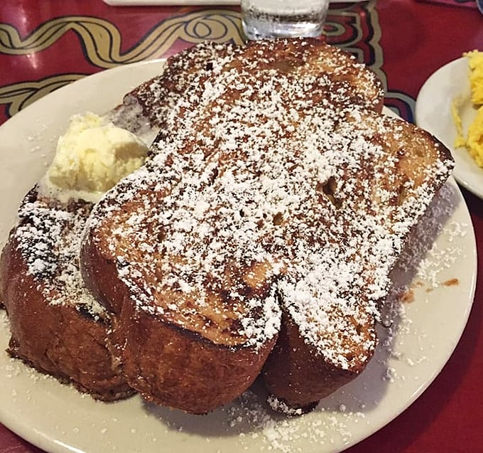 French toast so thick it could double as a mattress, dusted with powdered sugar like fresh snow on a delicious mountain.