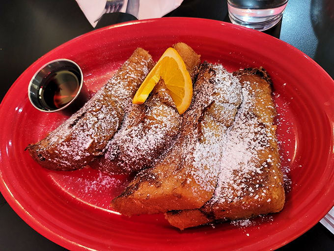 French toast that's dressed for success with powdered sugar and a citrus garnish—breakfast's answer to formal wear.