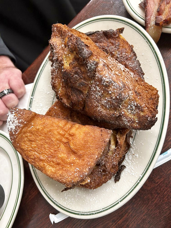 French toast that's crossed the line from breakfast to dessert territory &ndash; crispy, custardy, and dusted with powdered sugar like a Philadelphia winter.