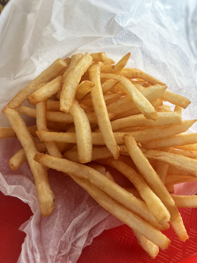 French fries that achieve the golden ratio: crispy exterior, fluffy interior, and just enough salt to make you reach for another.