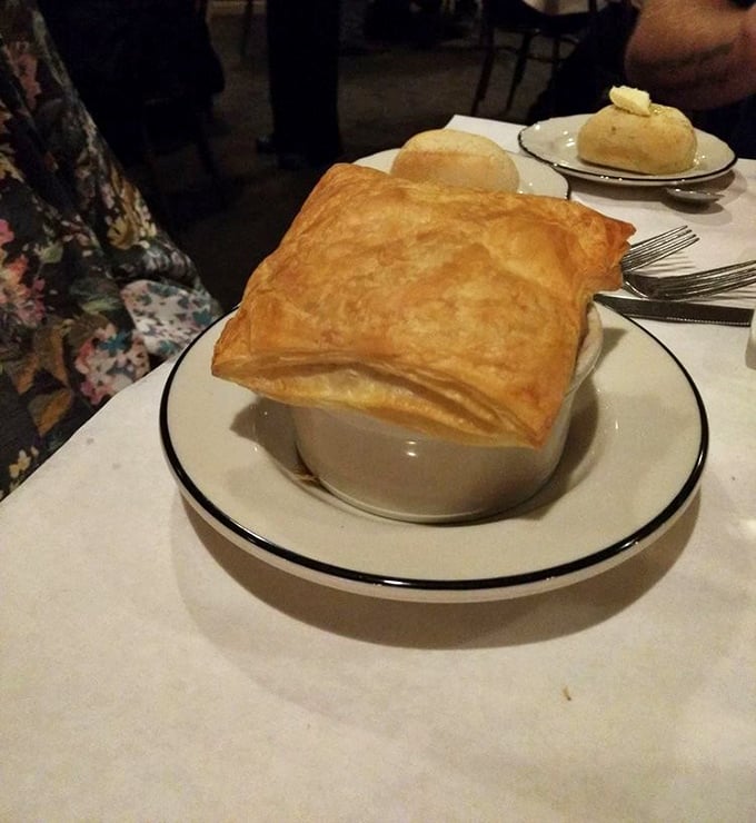 Beneath that golden pastry dome lies a soup so comforting it could end family feuds and broker peace treaties.