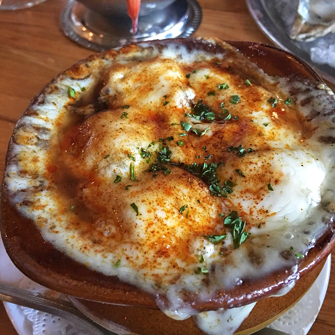 Bubbling cheese, golden-brown crust—this French onion soup isn't just comfort food, it's a warm hug in a ceramic crock.