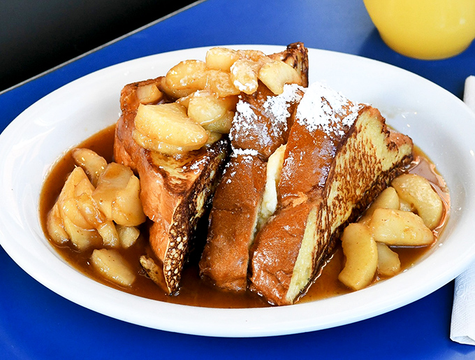 French toast that makes you question all other breakfast choices. Caramelized bananas and real maple syrup transform bread into something transcendent.