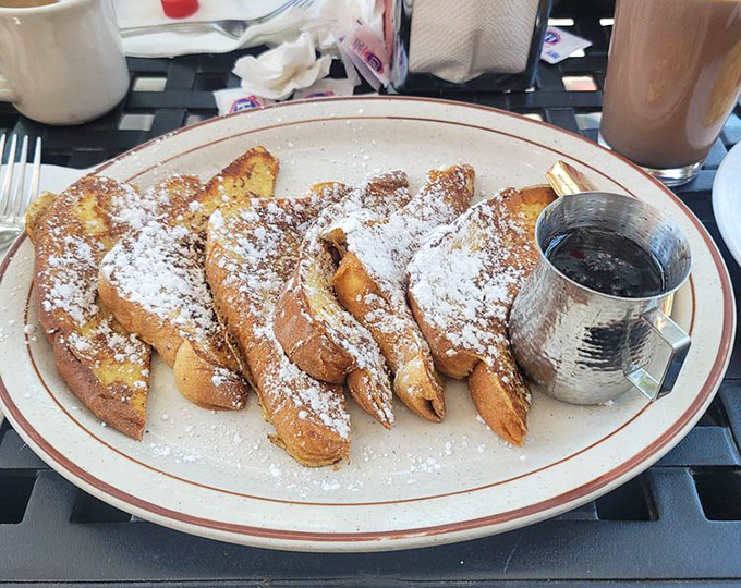 French toast so golden and fluffy, it's basically edible sunshine dusted with powdered sugar dreams.