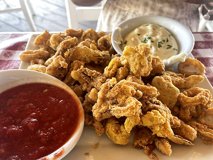 These golden-fried calamari aren't just appetizers—they're crispy little rings of joy that make sharing feel like a moral dilemma.