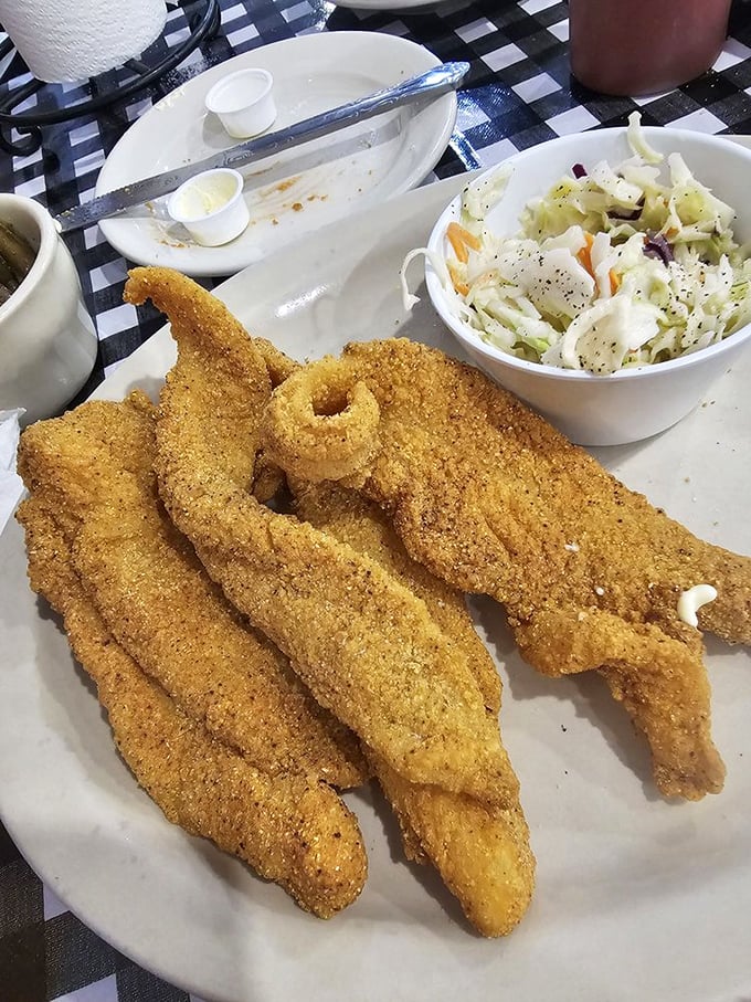Golden-crusted catfish that would make a fisherman weep with joy, paired with coleslaw that provides the perfect cool counterpoint.