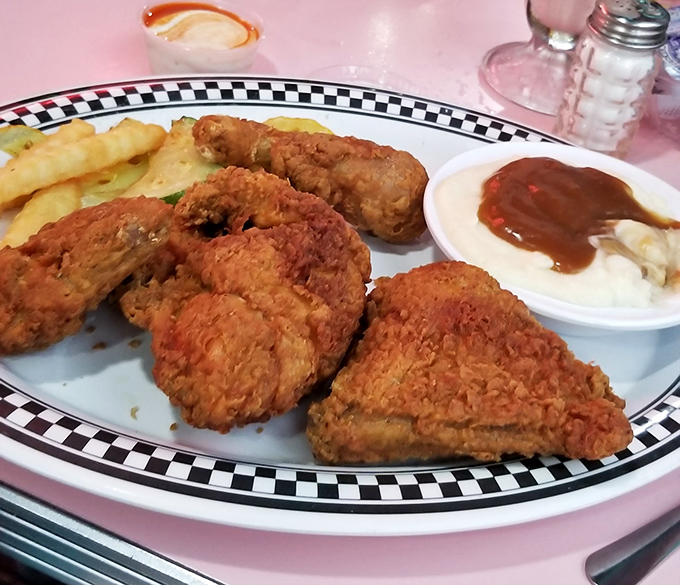 Fried chicken so golden it deserves its own Fort Knox. Crispy on the outside, juicy on the inside&mdash;the way the universe intended chicken to be enjoyed.