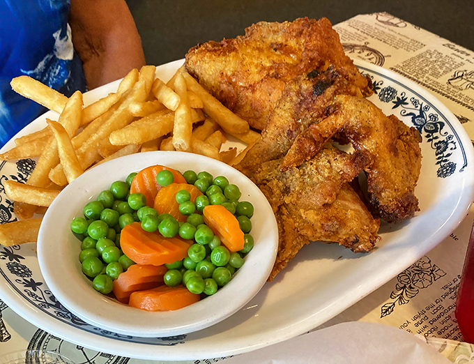 Fried chicken that achieves the holy trinity of poultry perfection: crackling golden exterior, juicy interior, and sides that don't feel like afterthoughts.