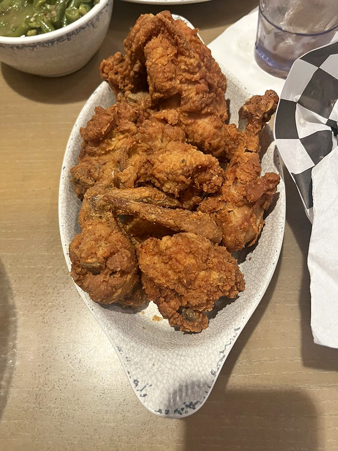 Fried chicken with a crust so perfectly golden and crunchy, it deserves its own standing ovation and Grammy nomination.