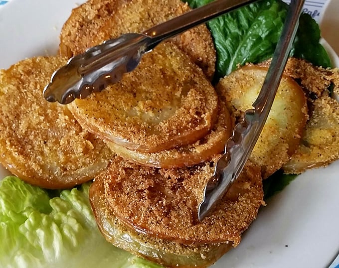 Fried green tomatoes: crispy, cornmeal-crusted discs of tangy goodness that make vegetables feel like an indulgence rather than a virtue.