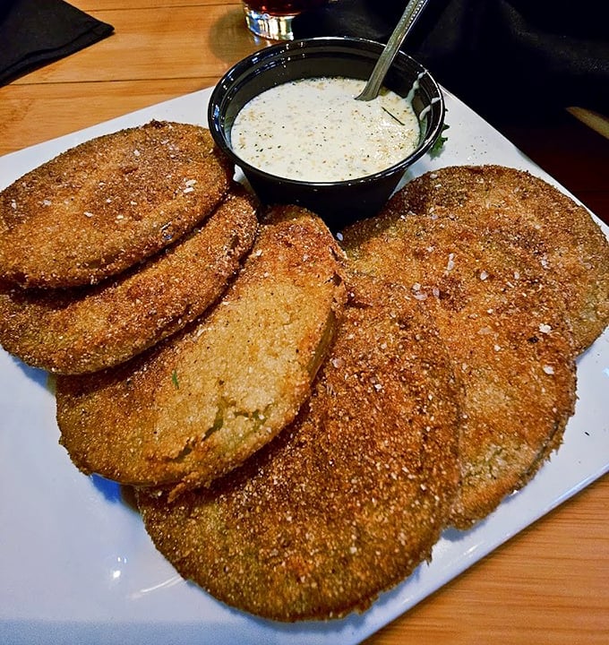 Fried green tomatoes &ndash; the South's gift to the culinary world. Cornmeal-crusted discs of tangy goodness with a dipping sauce that demands to be swiped clean.