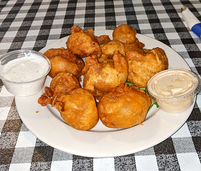 Golden-brown fried mushrooms that crunch like nature's popcorn, served with creamy dipping sauce&mdash;proof that vegetables can be both virtuous and deliciously sinful.