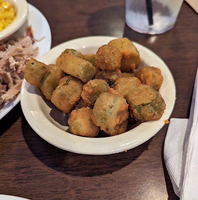 These golden nuggets of fried okra defy the vegetable's slimy reputation, transformed into addictive bites that disappear faster than you can say "Pass the plate."