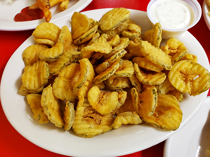 These fried pickles aren't just a side dish, they're a religious experience&mdash;crunchy, tangy discs of happiness worth every calorie.