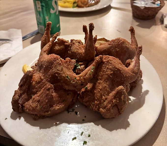 These fried quail look like they've been given the Colonel's secret treatment, but with a PhD upgrade. Crispy, golden, and ready for their close-up.