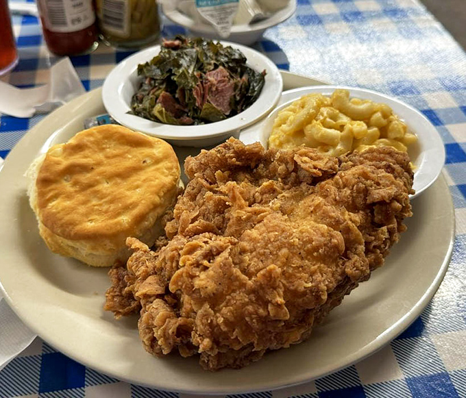 Southern comfort on a plate: crispy fried chicken, collard greens, and mac & cheese that could make your grandmother jealous.