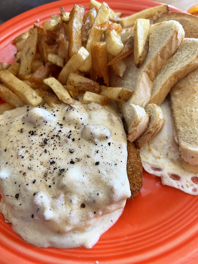 Home fries that actually taste like home&mdash;crispy, seasoned perfection alongside a gravy-smothered masterpiece that makes diet plans vanish into thin air.