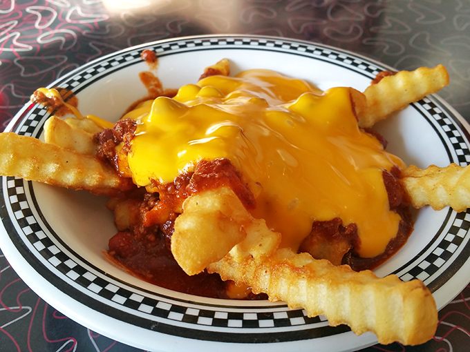 Chili cheese fries that make you forget your cholesterol count. The cheese melts into the chili like it's finding its soulmate. 