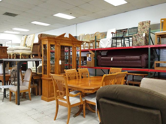 Mid-century dining sets mingle with contemporary sofas in the furniture section. That wooden hutch has seen more family dinners than your average Thanksgiving turkey.