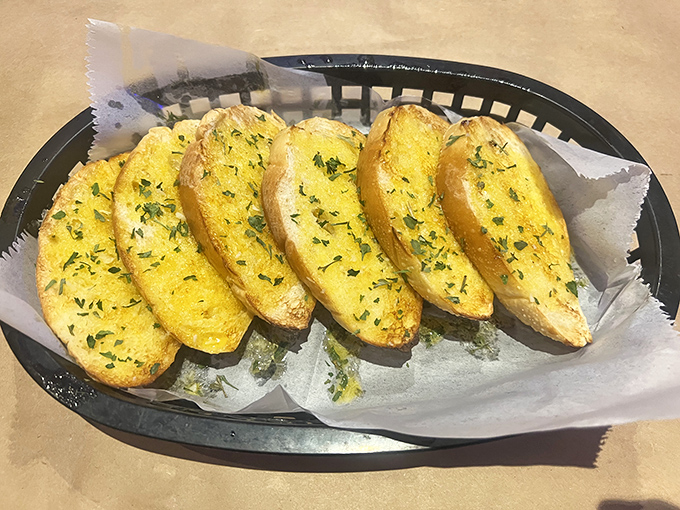 These aren't just garlic bread slices &ndash; they're butter-soaked flavor sponges, perfect for mopping up every last drop of that precious seafood sauce. Diet starts tomorrow.