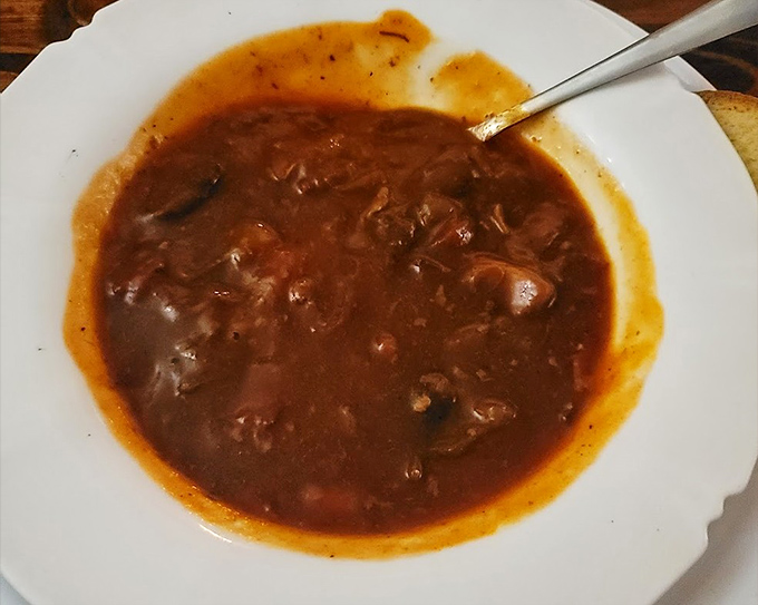 Rich, hearty goulash swimming in its savory gravy, the kind of soup that could warm you through a Bavarian winter.