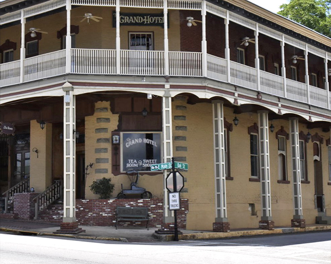 The Grand Hotel stands proudly on its corner, those wraparound porches practically begging you to sit a spell. Southern hospitality in architectural form.