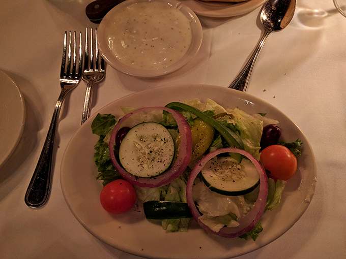 A Greek salad that respects simplicity&mdash;crisp vegetables, vibrant red onions, and cucumbers that actually taste like cucumbers. Revolutionary concept!
