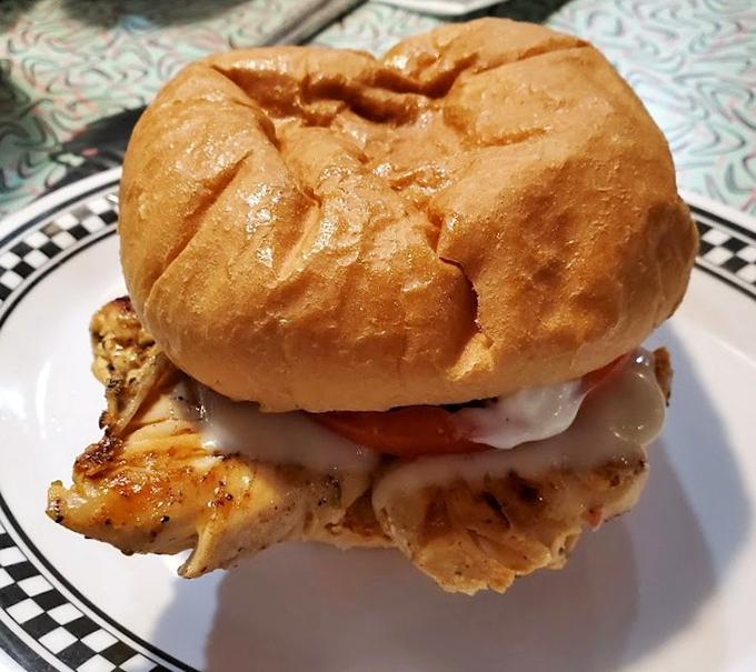 This grilled chicken sandwich isn't just lunch &ndash; it's architectural achievement stacked between a perfectly toasted bun.