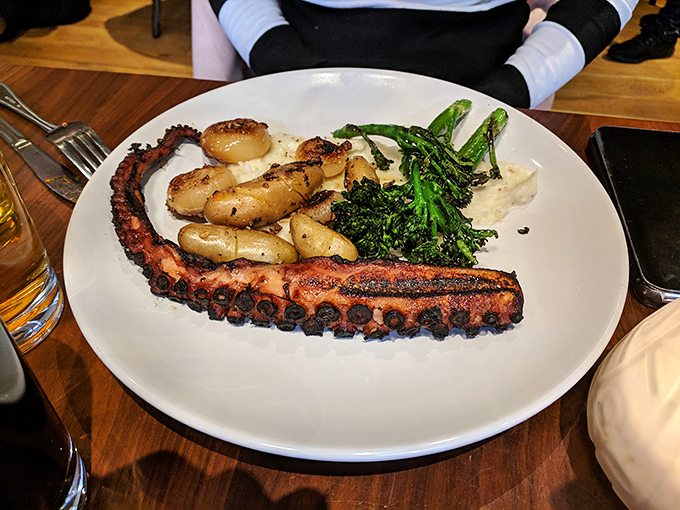 Grilled octopus that would make Poseidon jealous, perfectly charred and served with seasonal vegetables – proof that Butcher Bar's talents extend beyond land animals.
