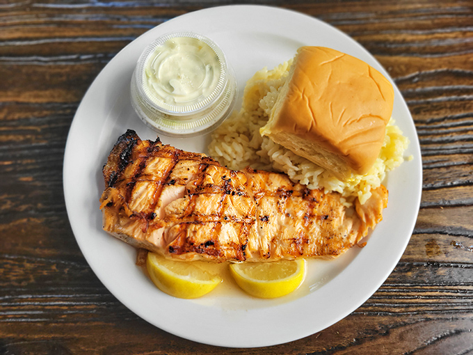 Perfectly grilled salmon with those coveted crosshatch marks that say "someone in this kitchen knows exactly what they're doing." Simple, honest seafood at its finest.
