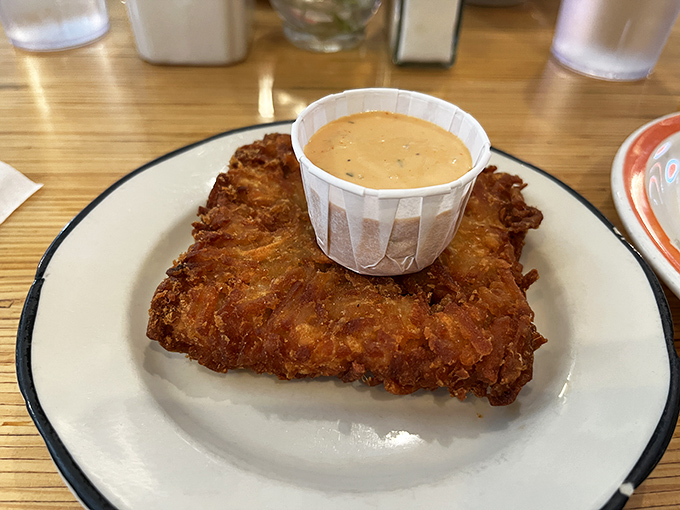Golden-brown perfection that puts ordinary hash browns to shame. That dipping sauce isn't just an accessory—it's a necessity for maximum flavor immersion.