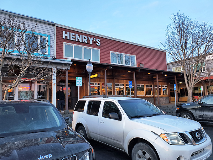 Henry's Great Alaskan Restaurant stands ready to welcome hungry adventurers with its rustic wooden facade and promise of hearty meals after a day of exploration.