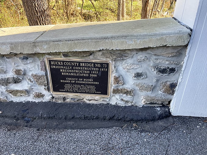A historical plaque reveals the bridge's timeline&mdash;originally constructed in 1875, reconstructed in 1955, rehabilitated in 2006&mdash;proving good maintenance is timeless.