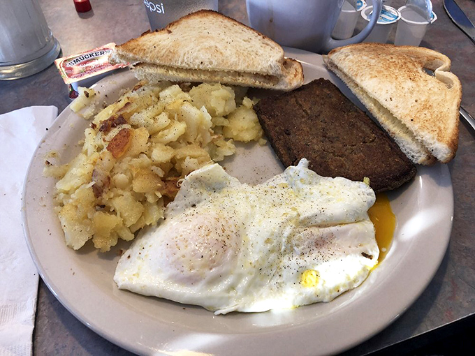A breakfast trinity: perfectly fried eggs, golden home fries, and toast &ndash; simple perfection that needs no Instagram filter.