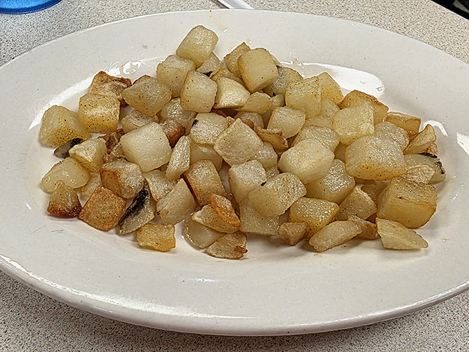 These home fries aren't just potatoes&mdash;they're little golden cubes of happiness, perfectly crisped and seasoned like they used to make before "artisanal" became a thing.