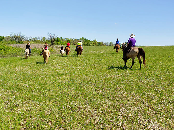 Trail riders living their best prairie life, channeling their inner John Wayne across Kansas's hidden wilderness.