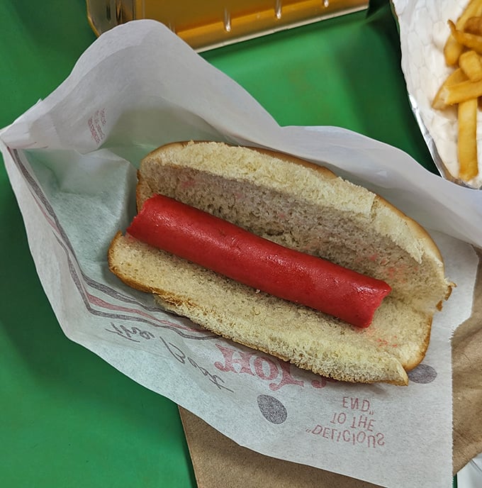 Hot dog purists rejoice! This classic red beauty on a perfectly steamed bun proves simplicity is the ultimate sophistication in the comfort food universe.