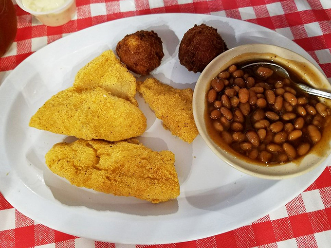 These hush puppies aren't just side dishes; they're golden orbs of cornmeal perfection that have probably prevented family feuds over who gets the last one.