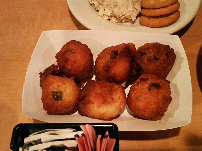 Hush puppies so perfectly golden they should come with a warning: "May cause involuntary sighs of happiness with each bite."