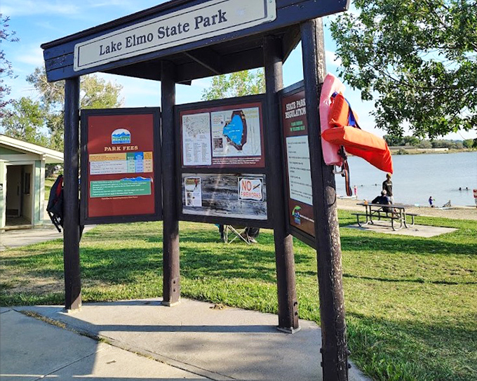 The information board – where rules and maps collide in a delightful dance of "here's what not to do" and "here's where to do it anyway."