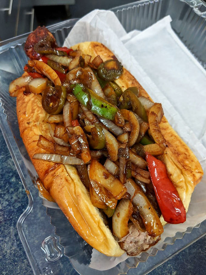 Saut&eacute;ed peppers and onions cascade over this Italian sausage like confetti at a parade, creating a symphony of colors and flavors.