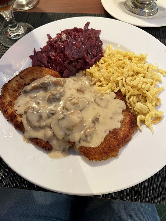 Jaeger Schnitzel: where crispy meets creamy. That mushroom sauce could make cardboard taste good, but thankfully it's coating perfectly breaded pork instead.
