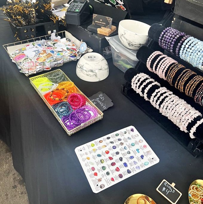 Jewelry displays transform the market into an open-air gallery where handcrafted accessories compete with produce for your attention.