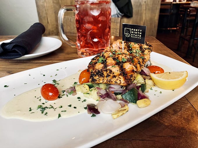 Perfectly grilled salmon resting on a bed of colorful vegetables&mdash;proof that healthy eating doesn't require a sacrifice of flavor.