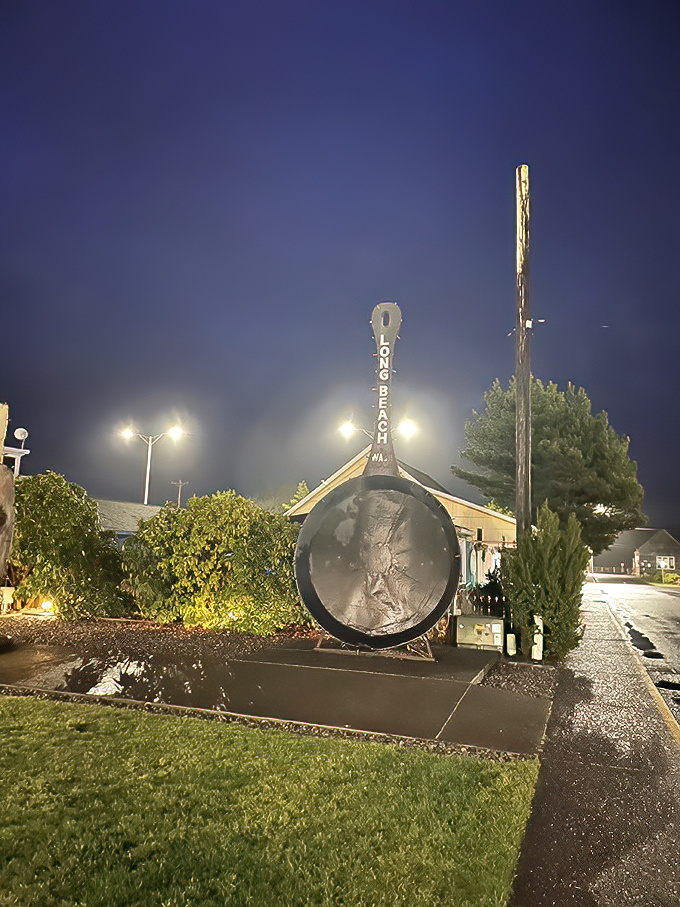 Even after sunset, the World's Largest Frying Pan commands attention, illuminated dramatically against the night sky like a cast iron celebrity.