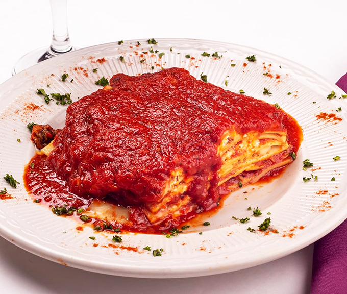 This isn't just lasagna; it's an archaeological dig through layers of pasta, cheese, and sauce that rewards every expedition with deliciousness.