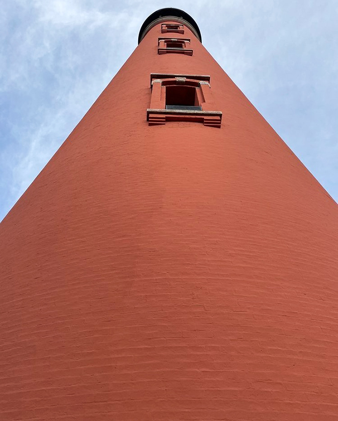 Looking up at this coral-colored giant gives you vertigo in the best possible way. Those windows aren't for decoration—they lit the keeper's way up!