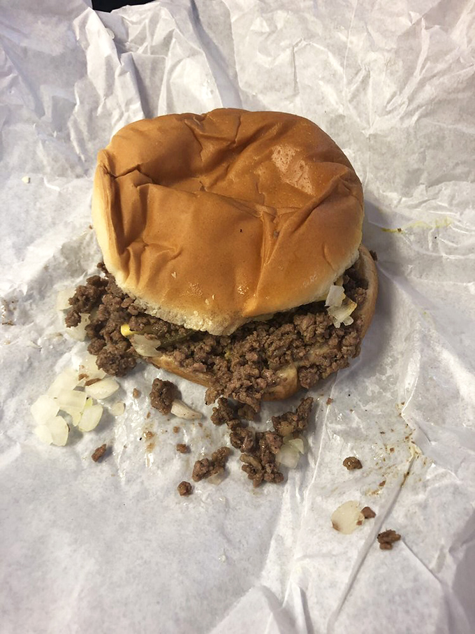 The iconic Maid-Rite in all its humble glory: seasoned loose meat on a soft bun, ready to challenge your sandwich-holding skills. 