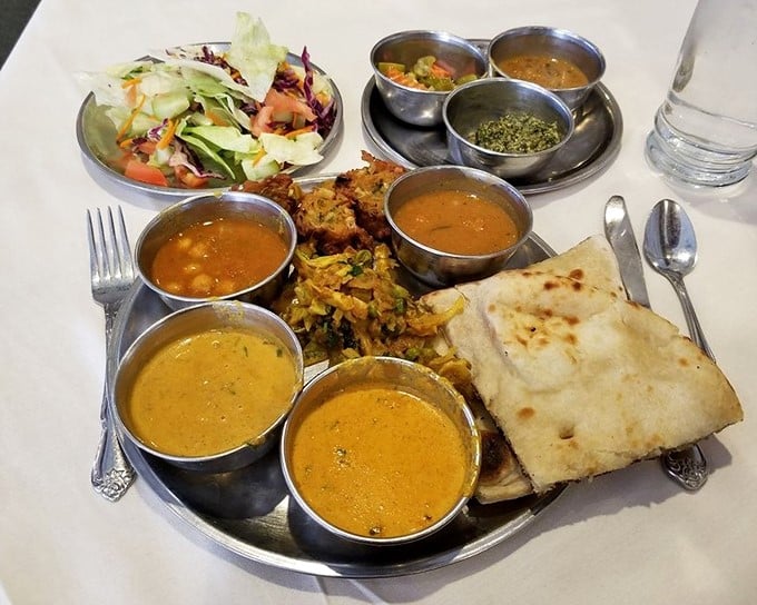 The buffet presentation is both art and science&mdash;metal serving dishes keeping everything at the perfect temperature while showcasing vibrant colors and textures.